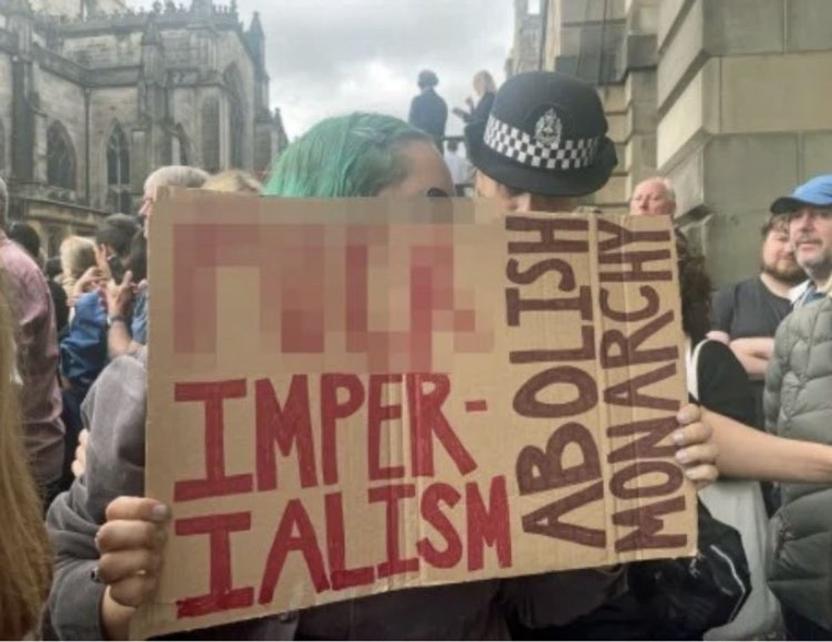Anti-monarchy protester who was holding sign reading ‘f*** imperialism ...